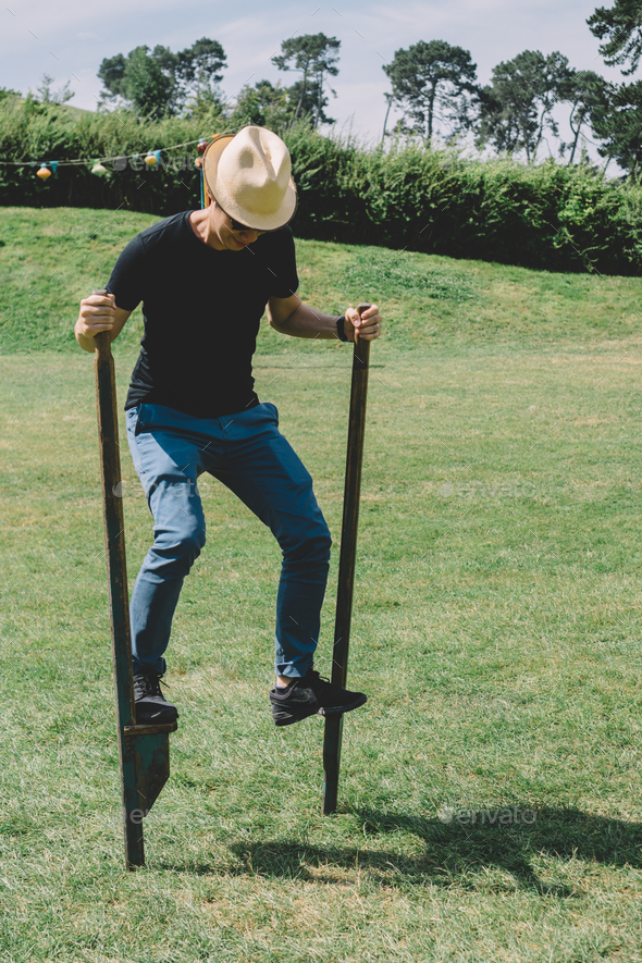 Man balancing on walking sticks Stock Photo by wikornr | PhotoDune