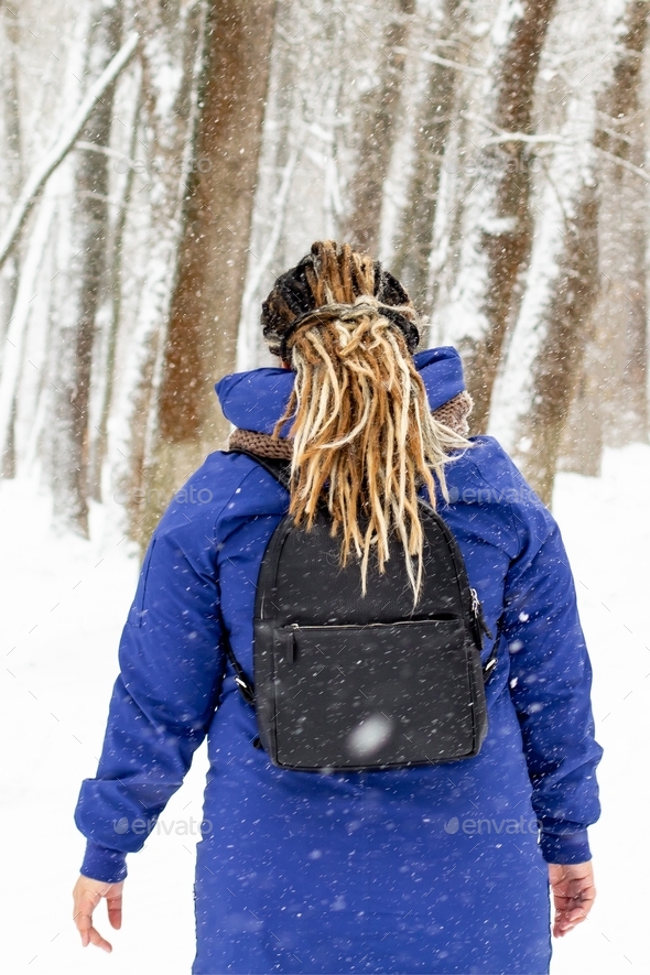 Back view of a woman with dreadlocks hairstyle. Woman with black ...