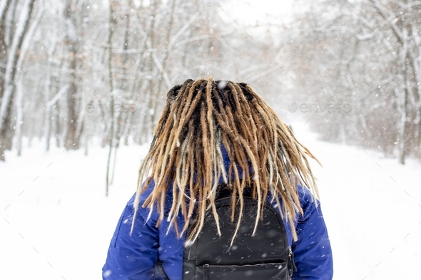 Back view of a woman with dreadlocks hairstyle. Woman with black ...