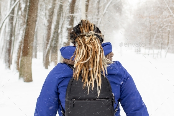 Back view of a woman with dreadlocks hairstyle. Woman with black ...