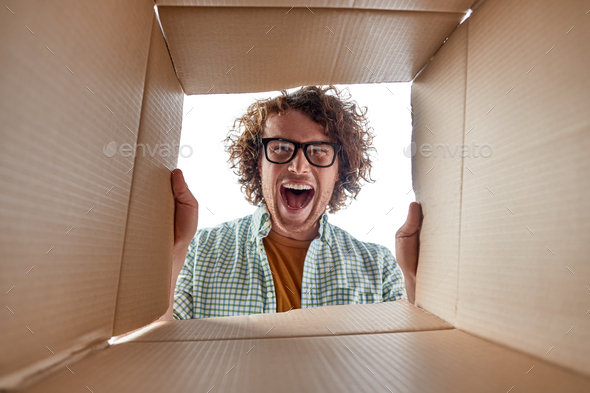 Man in glasses looking inside box Stock Photo by kegfire | PhotoDune