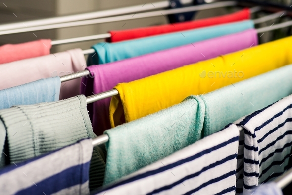Laundry day Rainbow color clothes hanging on washing line to dry ...