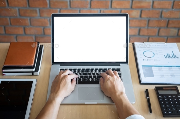 Image of Young man working in front of the laptop looking at screen ...