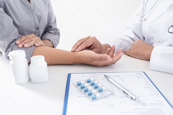 Doctor pulse measurement checking patient with examining Stock Photo by ...