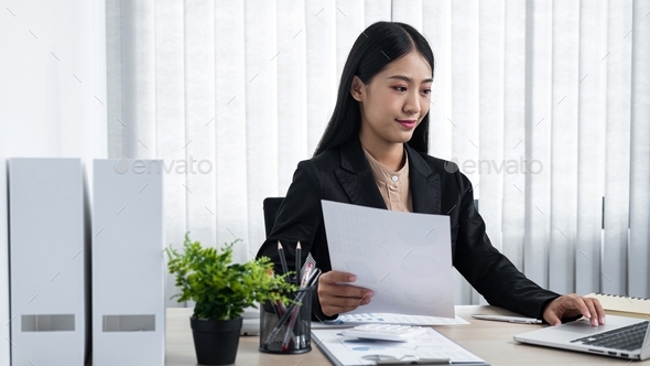 Young secretary woman checking her boss's meeting to typing email to ...