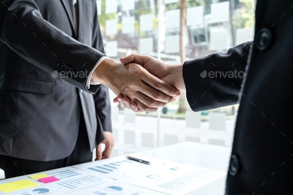 handshake of two business people after contract agreement to become a ...