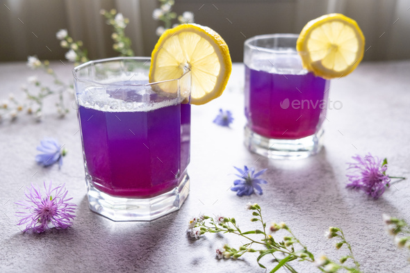 Colorful purple and pink drinks with lemon slices. Stock Photo by ...