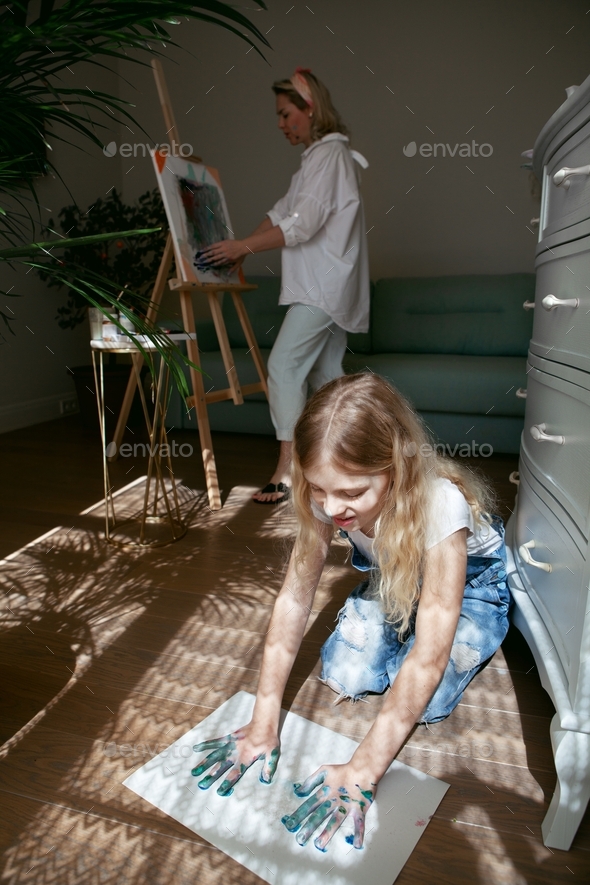 Girl Artist Drawing With Her Hands on paper Stock Photo by annazzhuk