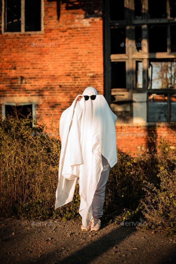 Celebrating halloween. Ghost Challenge 2021. Spooky trend season. A man ...