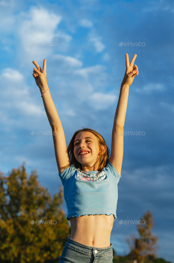 The little girl very happy relaxed in nature. Stock Photo by karrastock