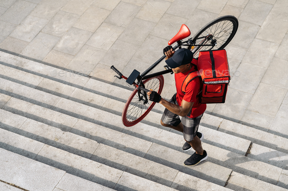 Messenger Man Delivering Package Stock Photo by nunezimage | PhotoDune