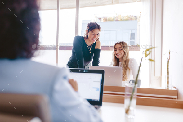 Three women working at the office Stock Photo by carlesmiro | PhotoDune