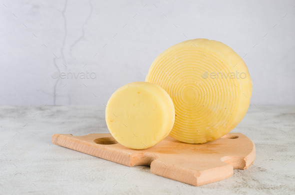 Assorted tasty cheese of different kinds and sizes on table. Stock ...