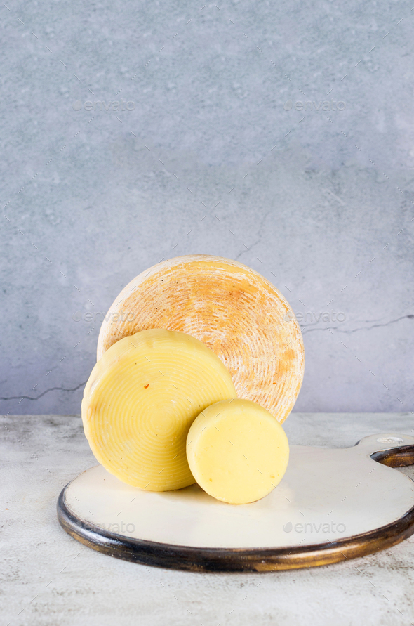 Assorted tasty cheese of different kinds and sizes on table. Stock ...