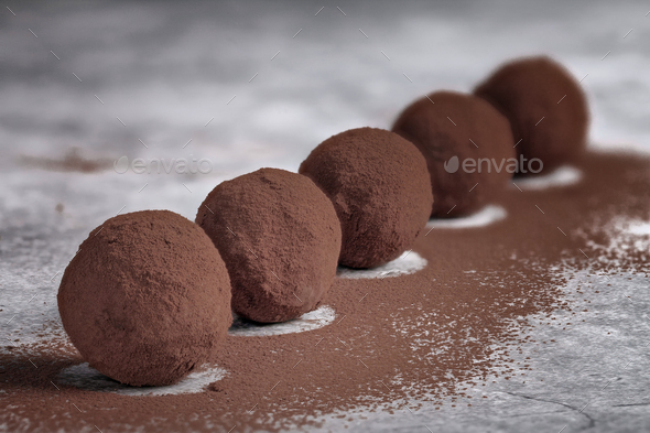 Chocolate candy. Round sweets. Cocoa powder Stock Photo by Shandor_gor