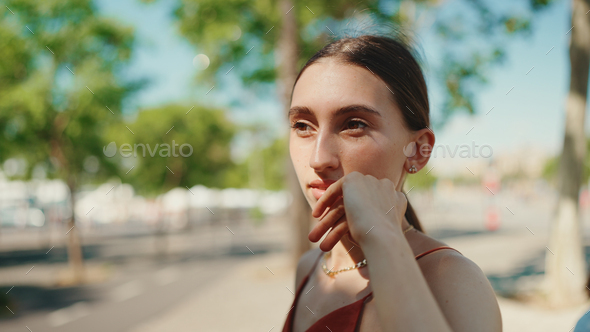 Pretty woman sitting on a park bench enjoying the good weather Stock ...