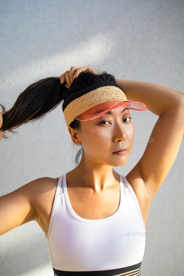 Fitness Concept. Happy asian woman doing exercises Stock Photo by nikolast1