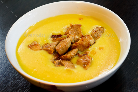 Pea puree with fried meat on a dark background Stock Photo by Statuska
