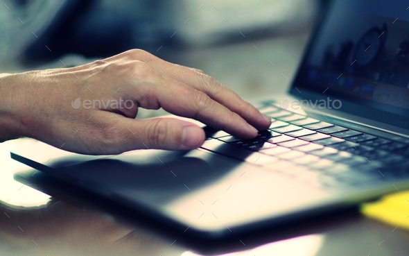 Woman using laptop and computer closeup table blur background. People ...