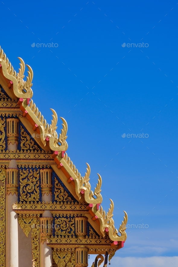 Beautiful golden ornamental Gable Apex on rooftop of traditional Thai ...