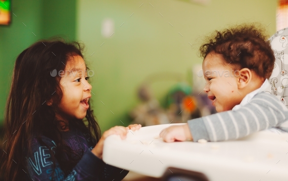 Diverse mixed race siblings brother and sister at home playing and ...