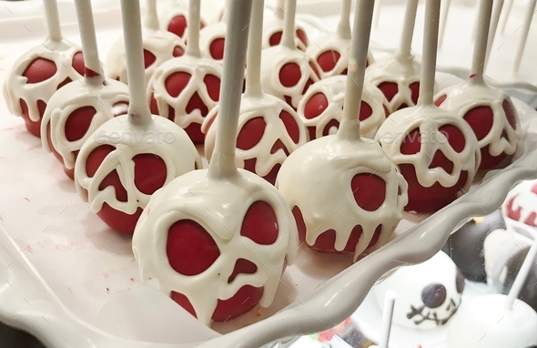 Red Poisoned candy apples with white chocolate scary faces for ...