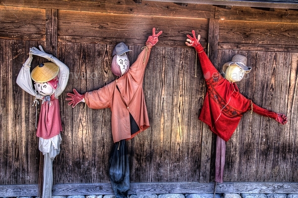 Puppets dancing and laying on a wooden wall Stock Photo by LeaMallo