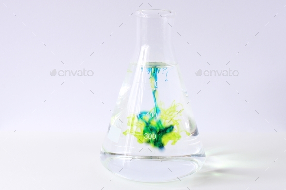 Beaker with colored water Stock Photo by MPPLLC45 | PhotoDune