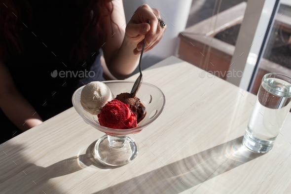 Girl eating gelato in restaurant Stock Photo by radio_sunnydale | PhotoDune
