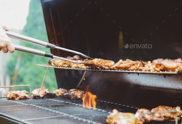 Summer barbecuing chicken at home on charcoal grill Stock Photo by R ...