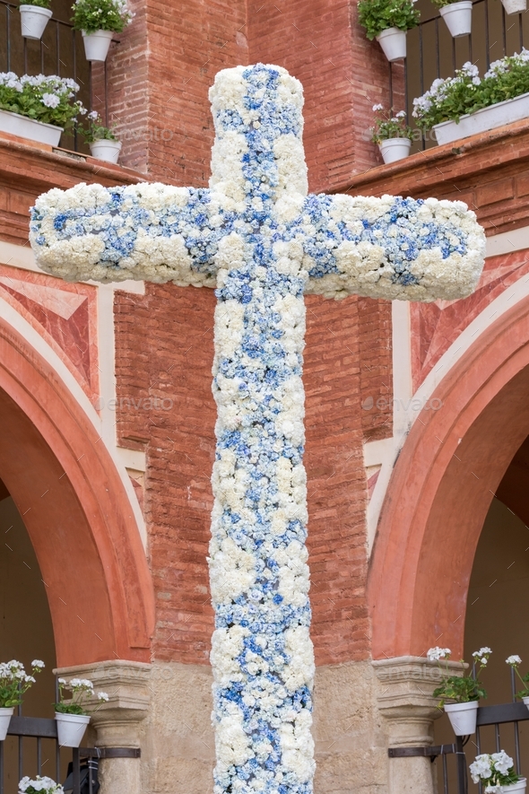 Large Christian cross covered with white and blue flowers for the City ...