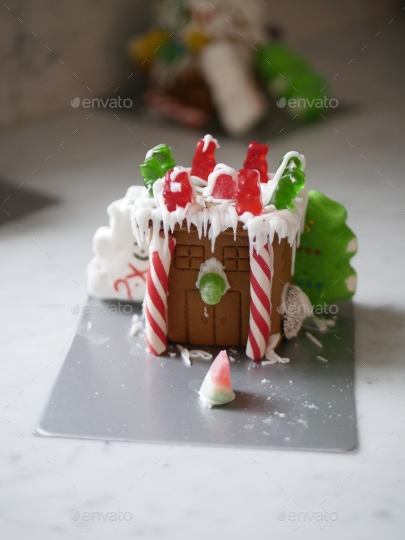 Gingerbread house with candy cane columns and gumdrops Stock Photo by ...