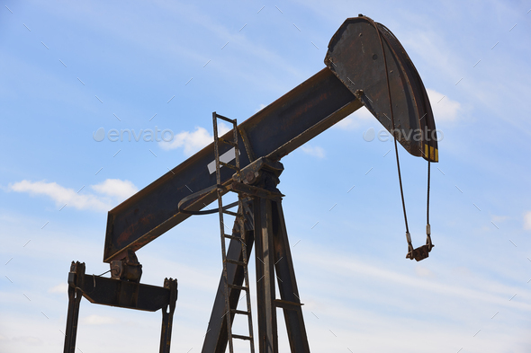Oil pumping machine. Pump jack. Petroleum extraction. Global warming ...