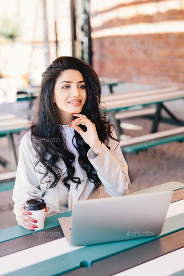 Elegant successful woman freelancer dressed formally using generic ...