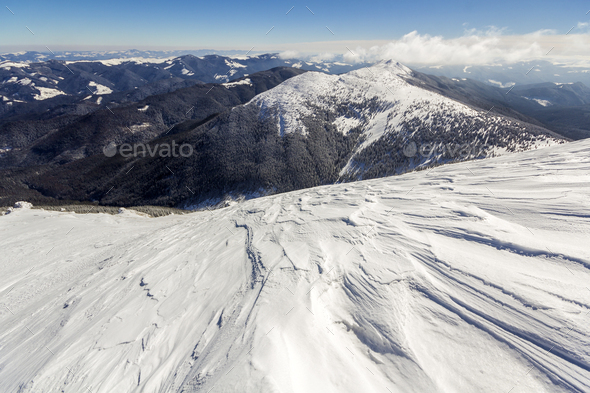 Beautiful winter landscape. Steep mountain hill slope with white deep ...