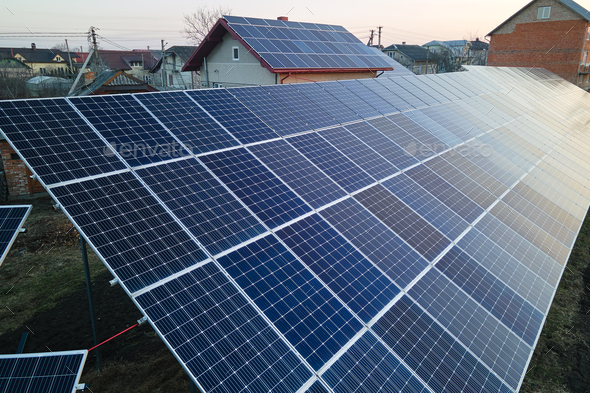 Solar photovoltaic panels mounted on stand-alone frame on backyard ...