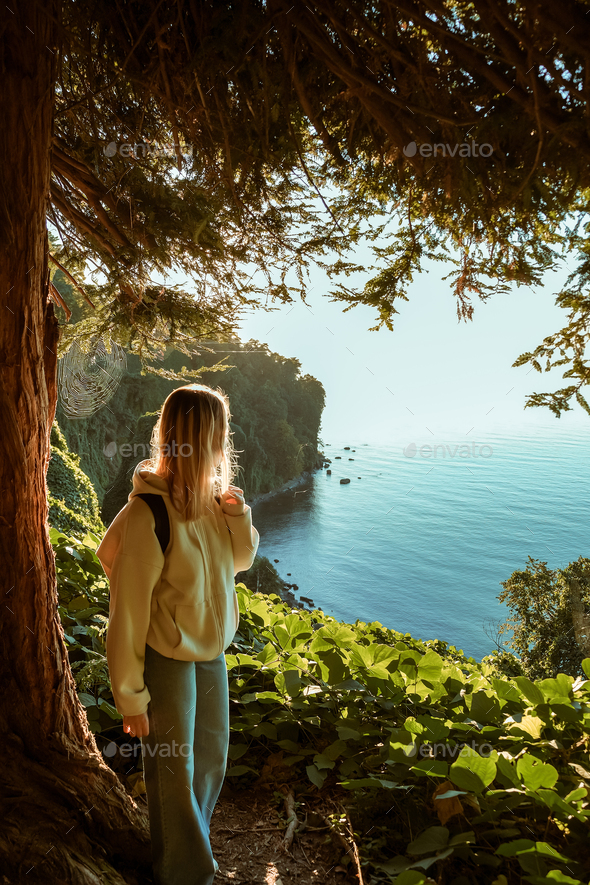 Travel. Girl travels through the mountains glamping, tents,waterfalls ...