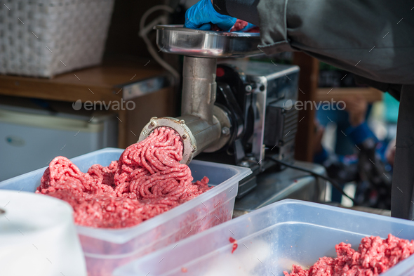 Tray of chopped meat, meat mincer, butcher's hand. Stock Photo by ...