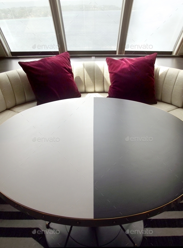 Interior design - round table, window seat, maroon velvet cushions ...