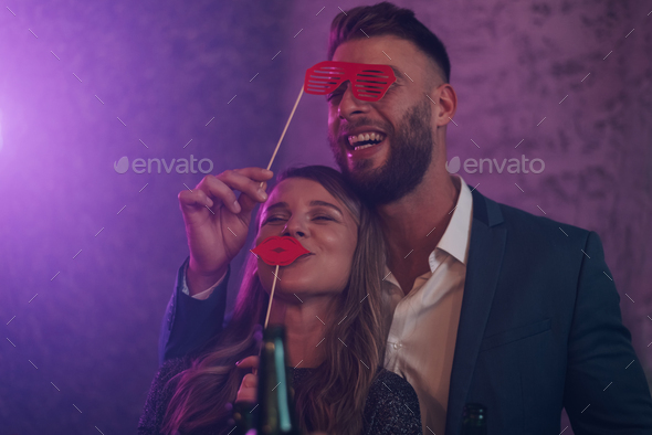 Happy couple dancing on a party in a club Stock Photo by zamrznutitonovi