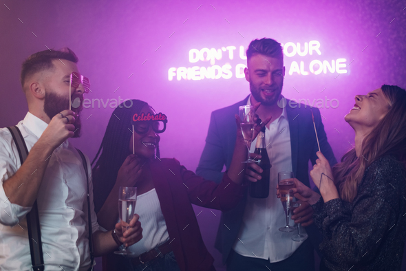 Happy group of friends dancing on a party in a club Stock Photo by ...