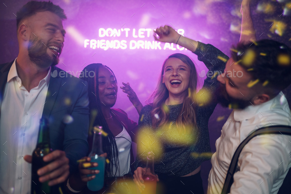 Happy group of friends dancing on a party in a club Stock Photo by ...