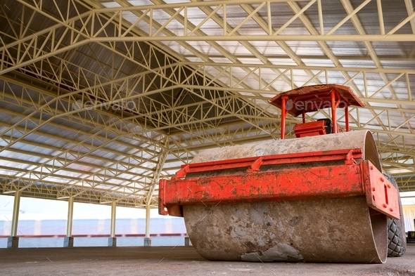 soil compactor roller inside of building structure in construction site ...