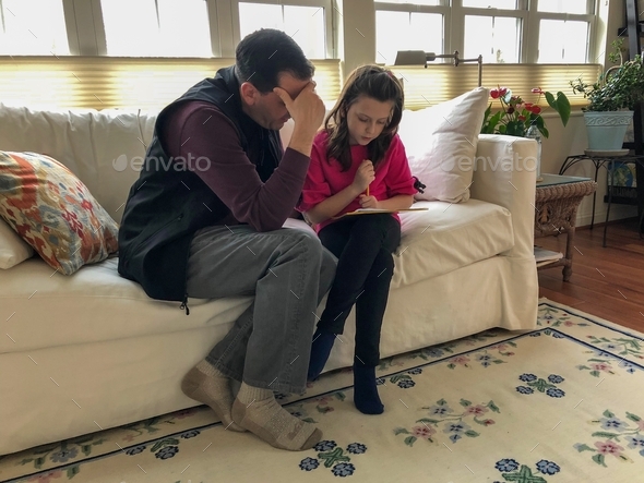 Gen X father helping his daughter with her homework. Stock Photo by ...