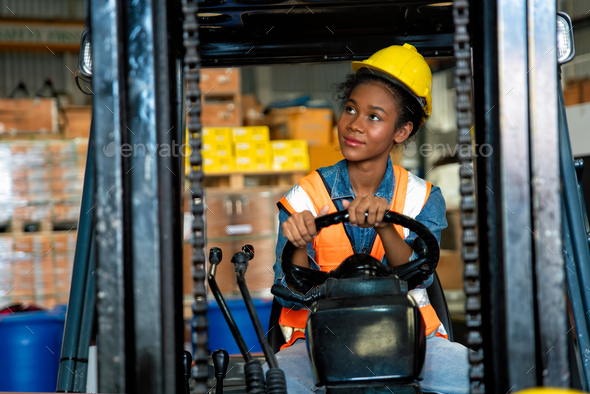 forklift operator in storage warehouse looking way during transport ...