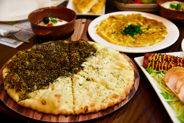 Arabian Breakfast on wooden table - Thyme and cheese pastry Stock Photo ...