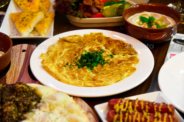 Arabian Breakfast on wooden table - Omlete Stock Photo by ActiorJordan