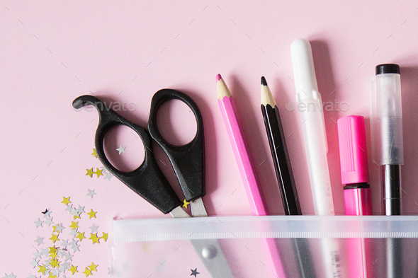 School supplies. Black, white and pink colors. Pink background. Back to ...