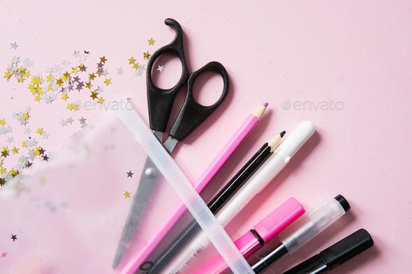School supplies. Black, white and pink colors. Pink background. Back to ...