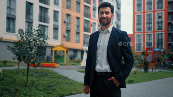 Happy homeowner successful man businessman architect realtor standing ...